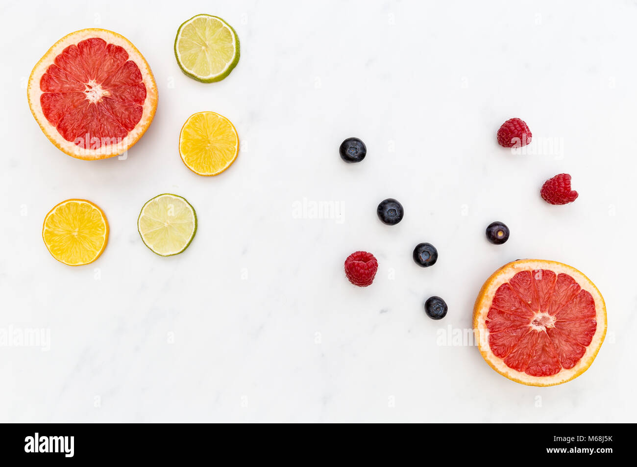 Fruit berries food background on white marble Stock Photo - Alamy