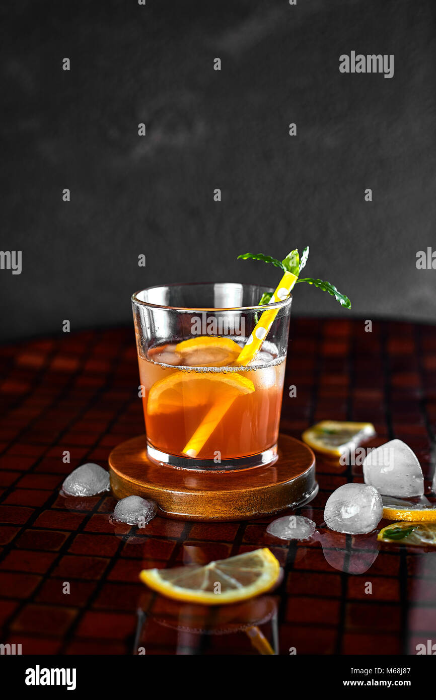 Iced lemon tea on dark background in glass. Summer cold Iced tea Stock ...