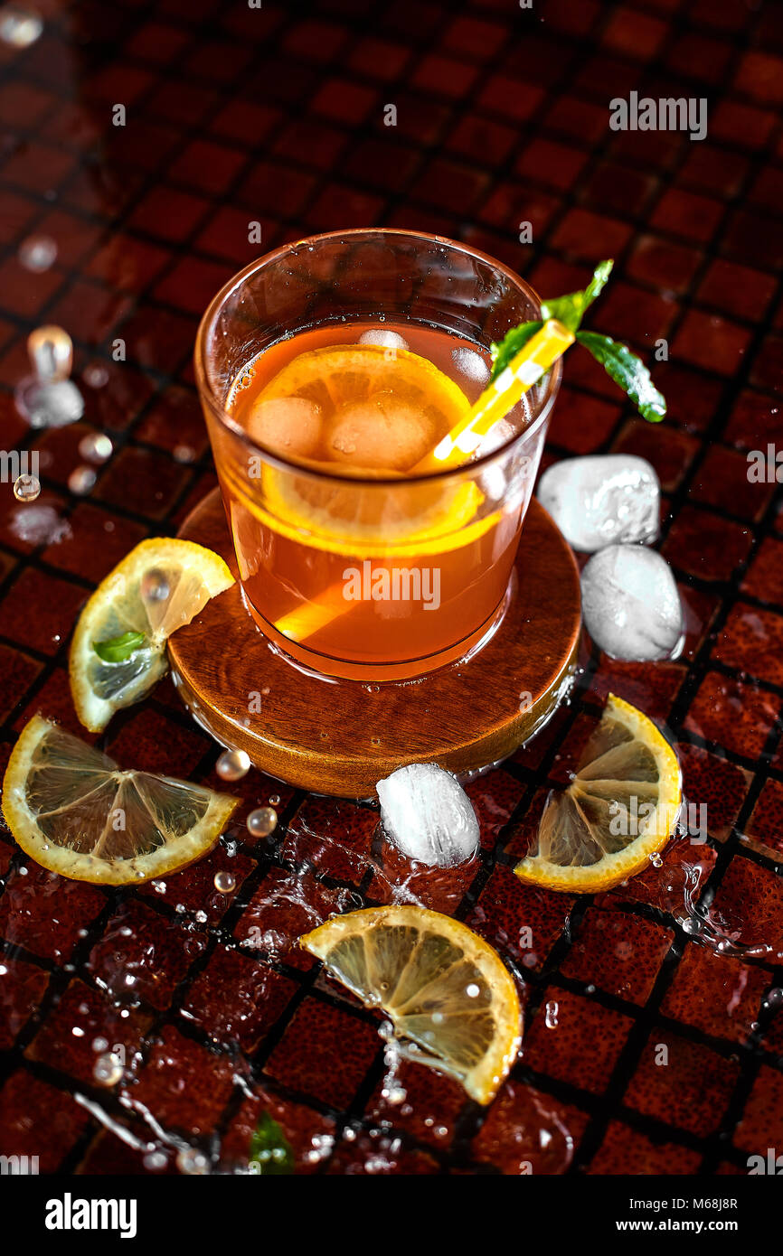 Iced lemon tea on dark background in glass. Summer cold Iced tea Stock ...