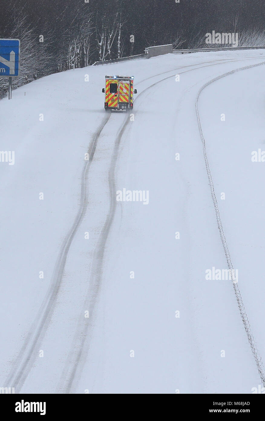 An ambulance on the M876 in snowy conditions, near Falkirk, as storm ...