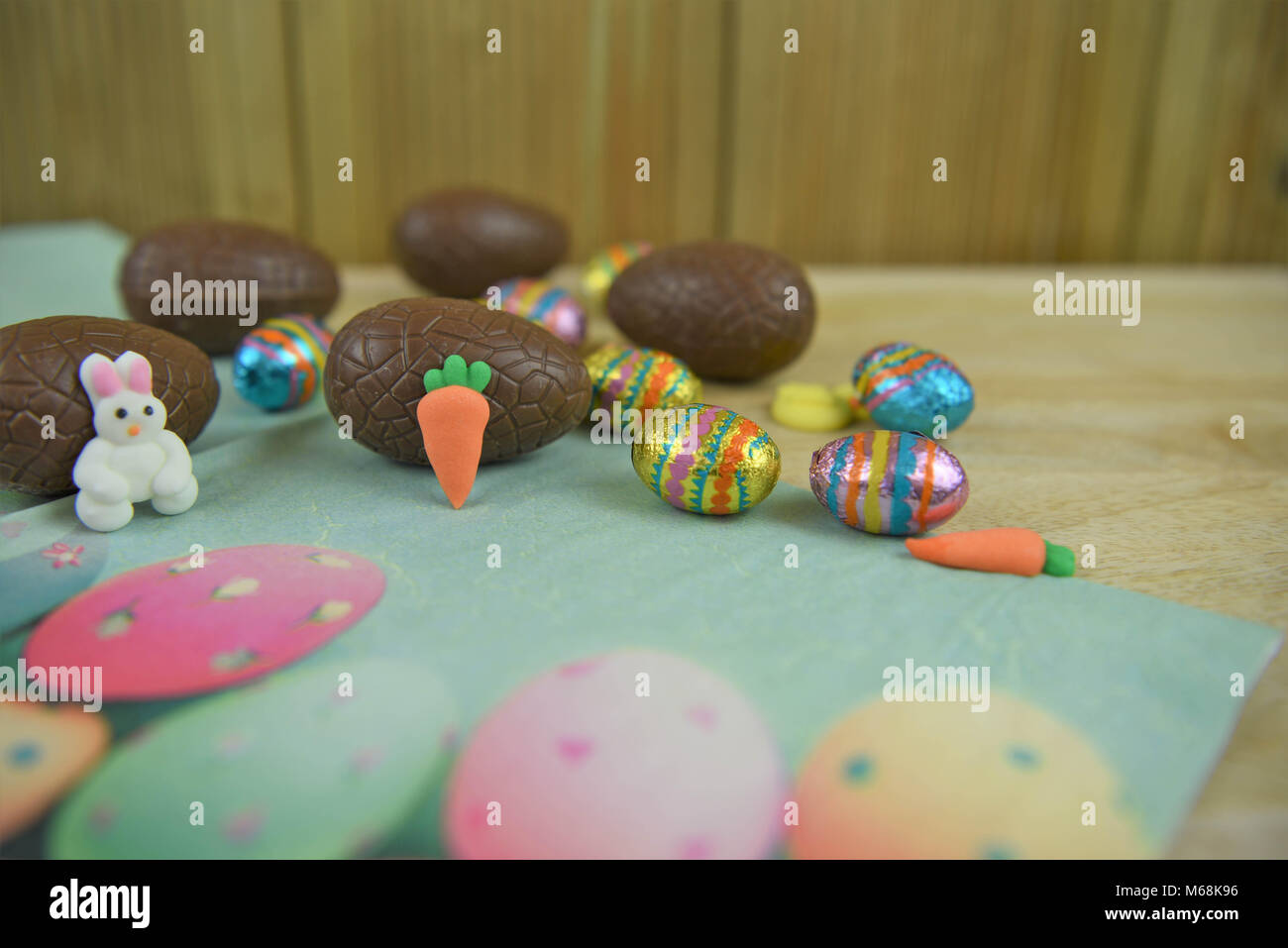 food with chocolate Easter eggs and decorations of iced carrots and ...