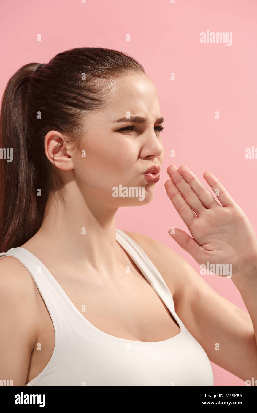 Young woman with disgusted expression repulsing something, isolated on ...