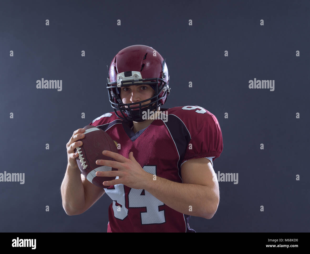 one quarterback american football player throwing ball isolated on gray ...