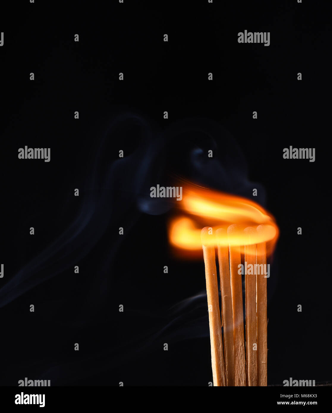 Spiral of fire on flaming matches Stock Photo - Alamy