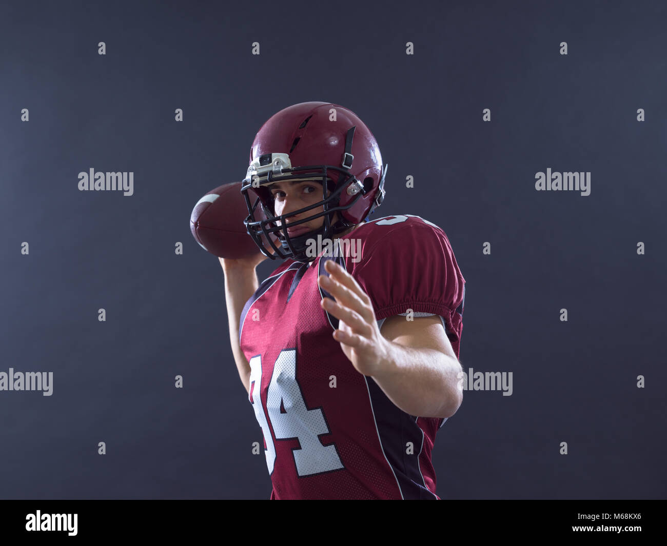 one quarterback american football player throwing ball isolated on gray ...
