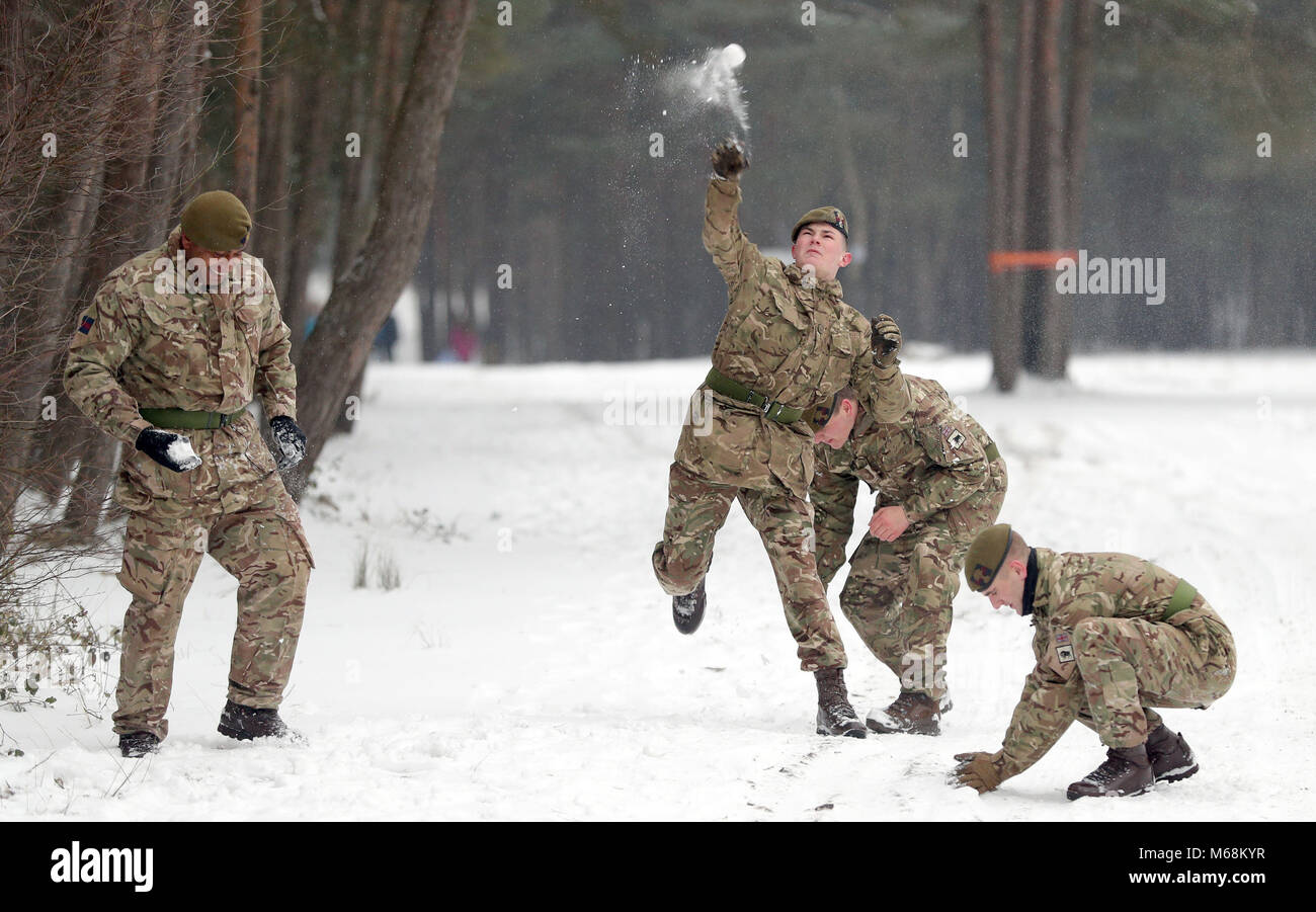 Members of 1st Battalion Welsh Guards take part in a snow ball fight ...