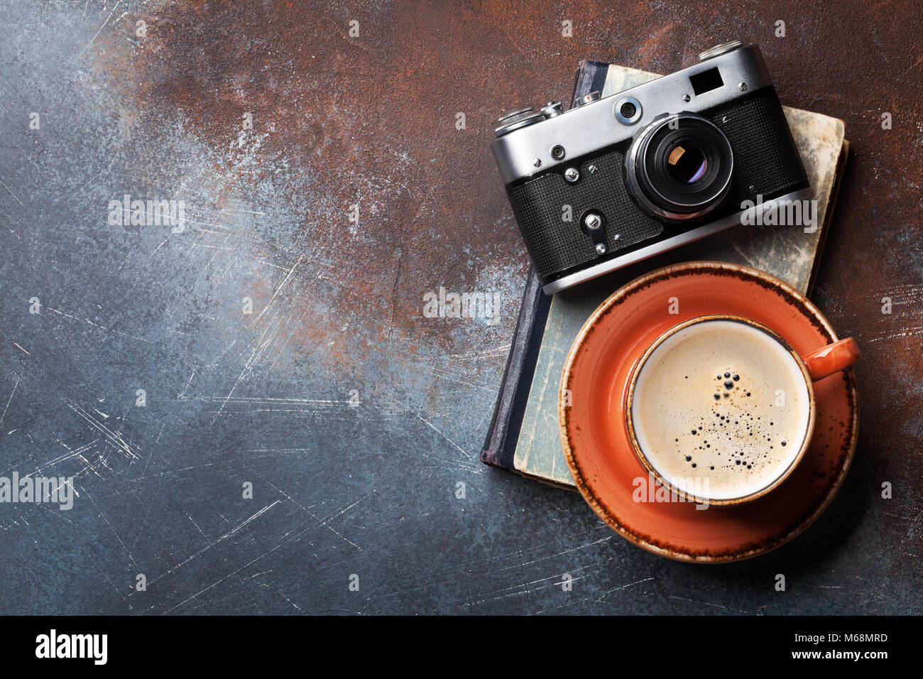 Coffee cup and retro camera over book. Top view with space for your ...