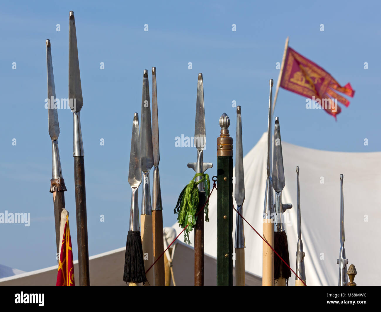 Set of medieval spear points against a blue sky Stock Photo - Alamy