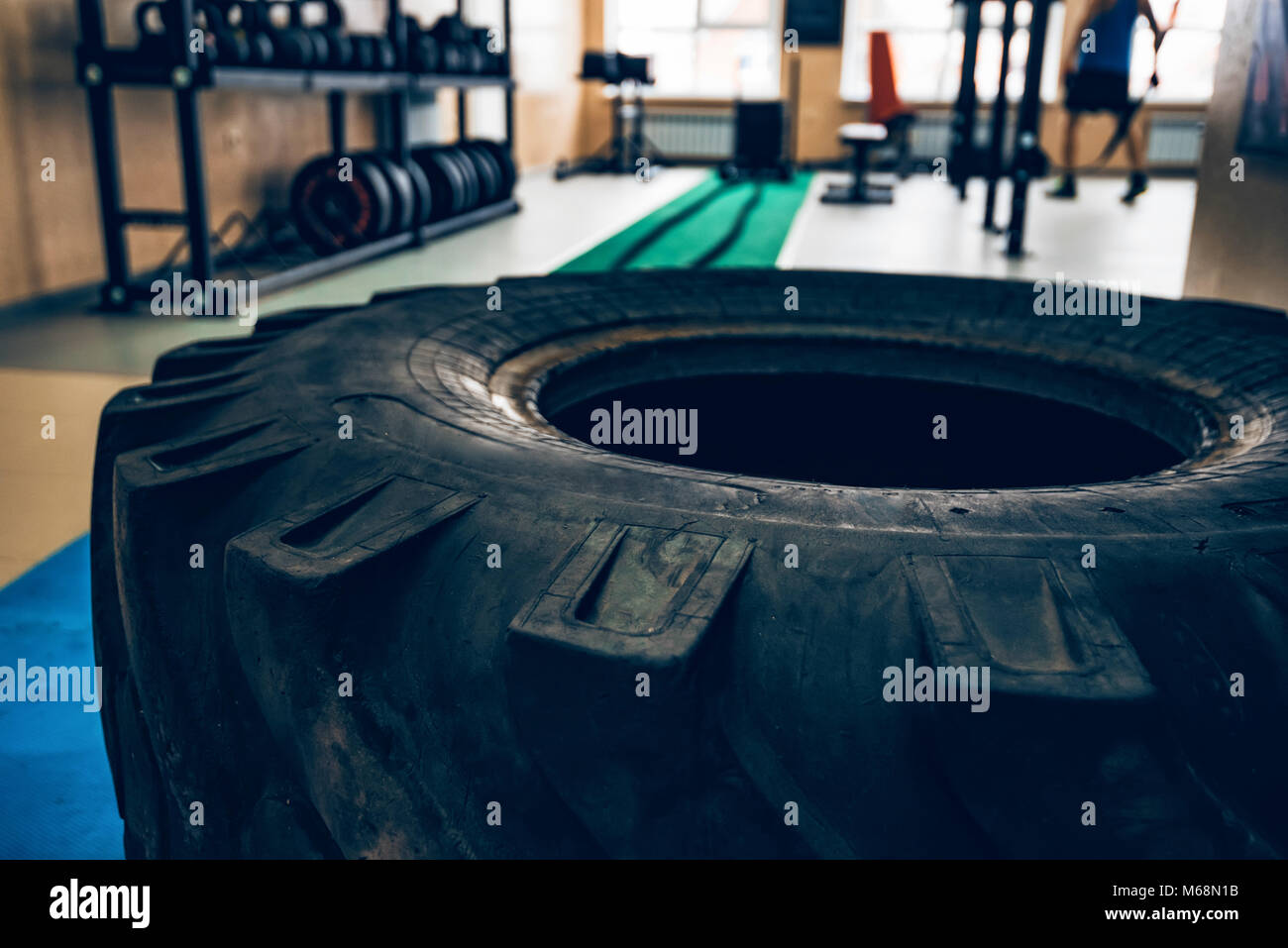 Big tire in modern gym Stock Photo - Alamy