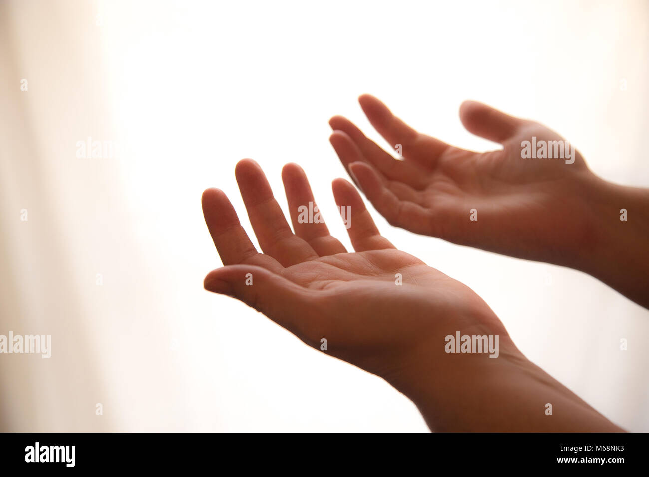 Two Hands Open in Worship Stock Photo - Alamy