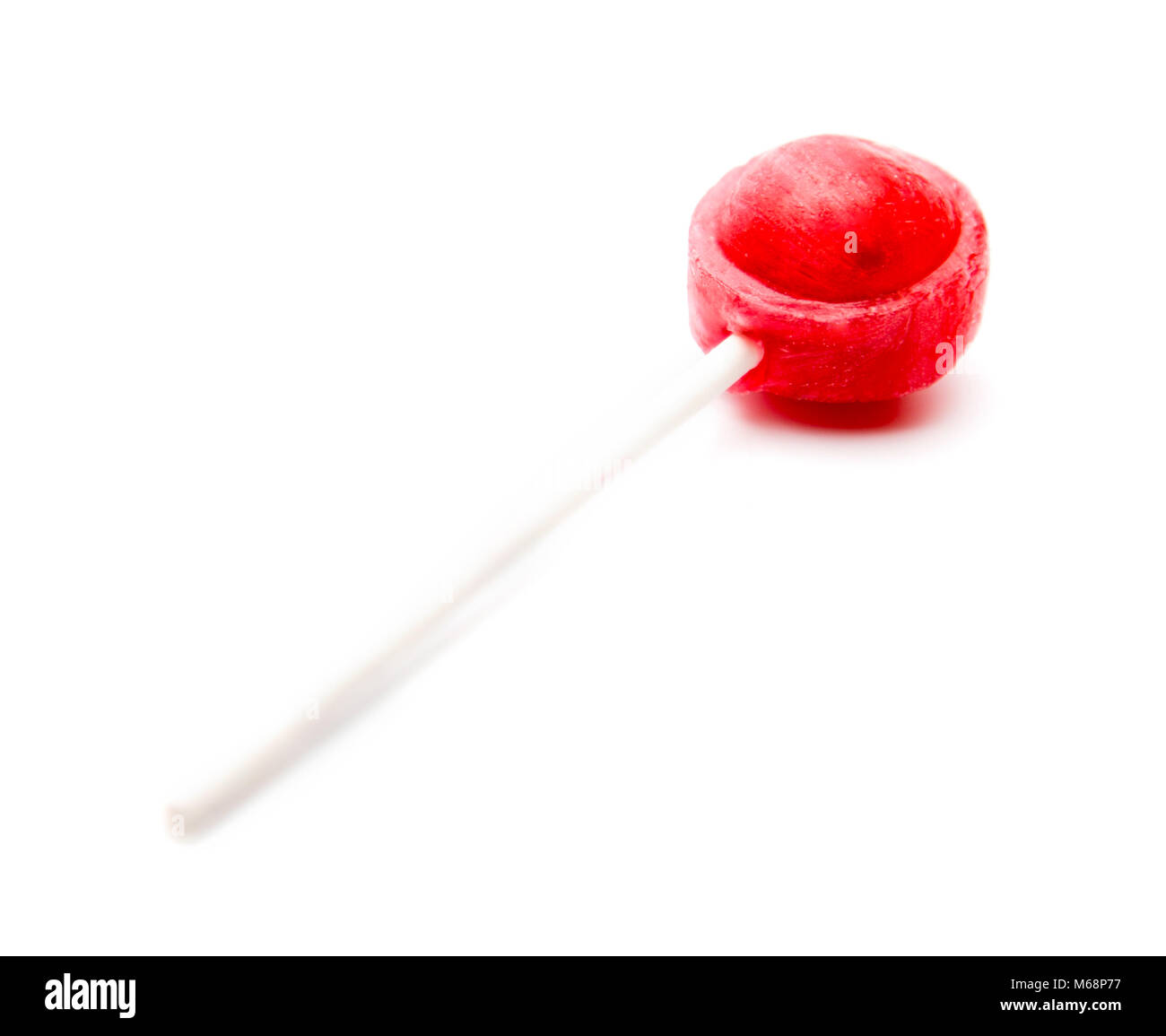 Single Red Lollipop on a White Background Stock Photo - Alamy