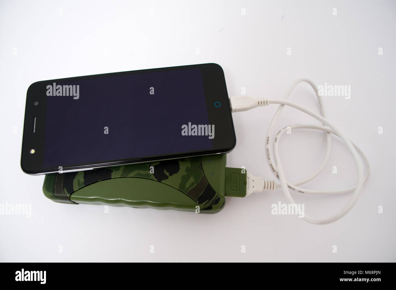 Charge your phone with the help of the military power bank packs Stock ...