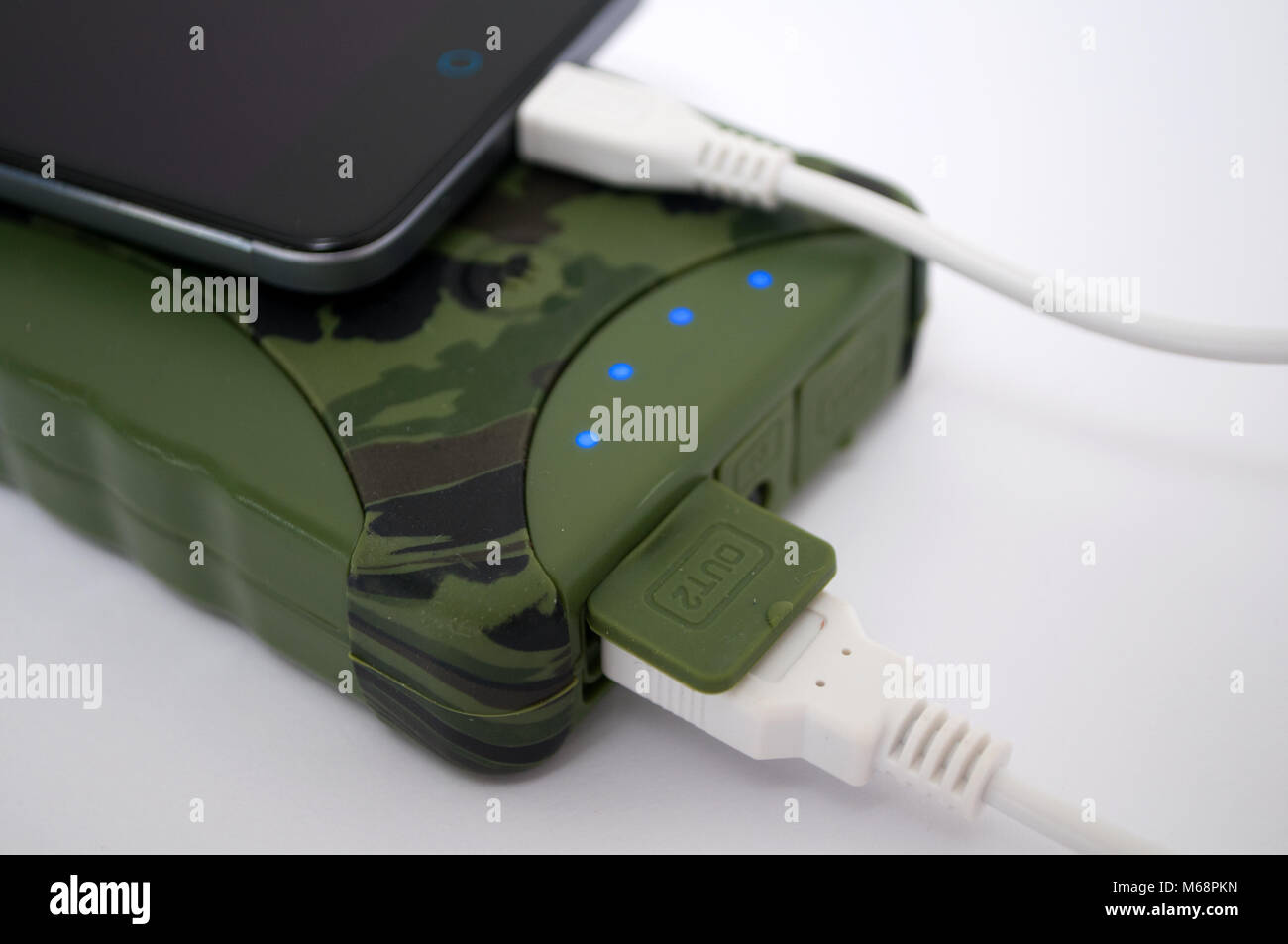 Charge your phone with the help of the military power bank packs Stock ...