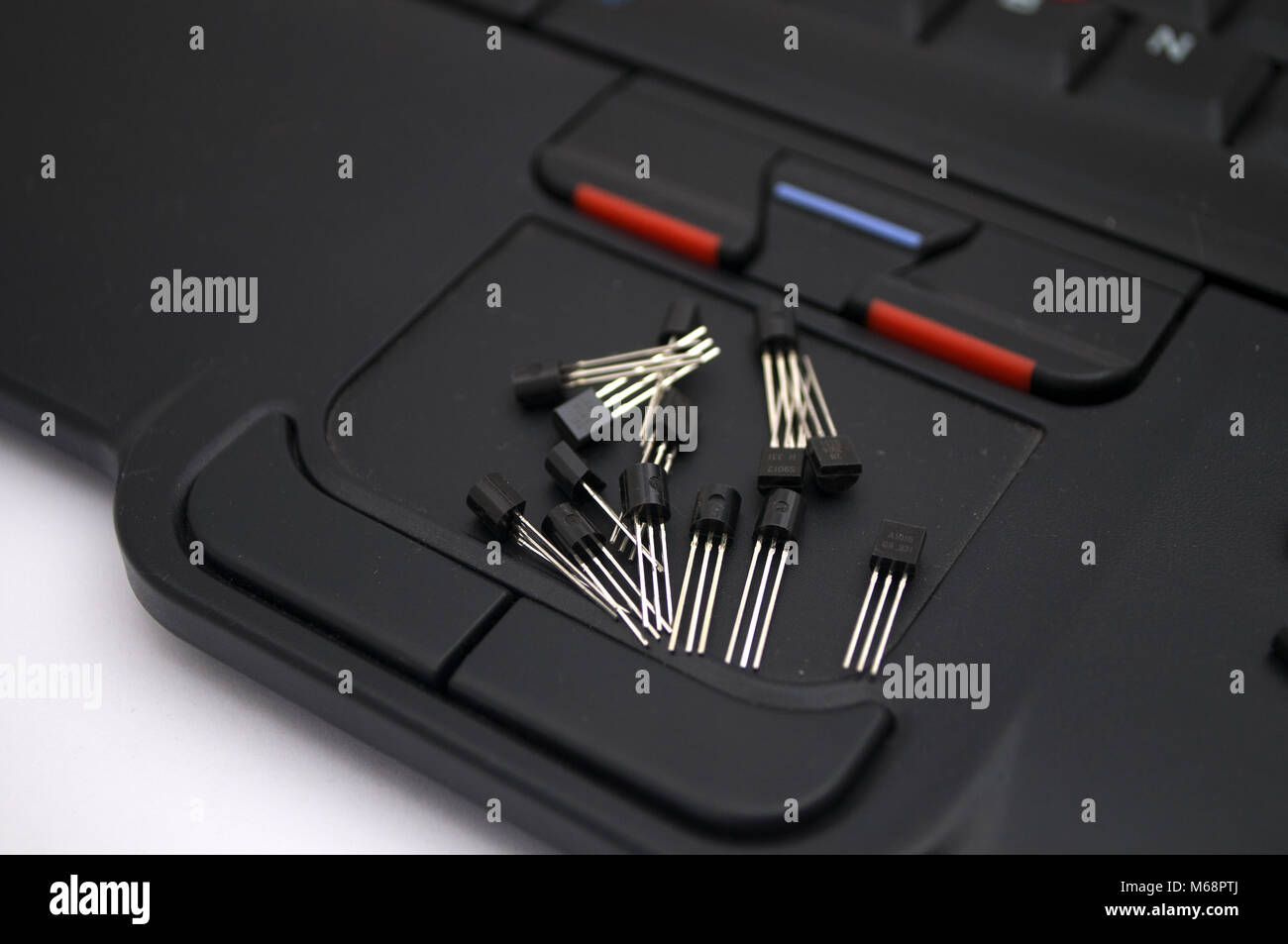 Arduino, wires and around transistors lined up on a white background ...