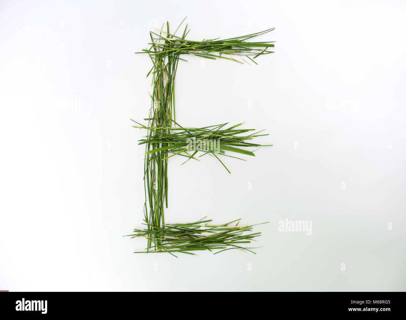 Letters of alphabet written with fresh green grass Stock Photo - Alamy