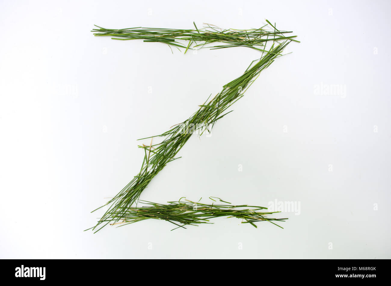 Letters of alphabet written with fresh green grass Stock Photo - Alamy