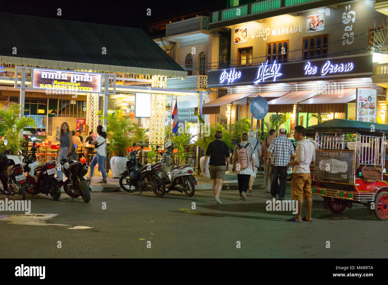 Kampot Cambodia - local people and tourists going to bars and ...