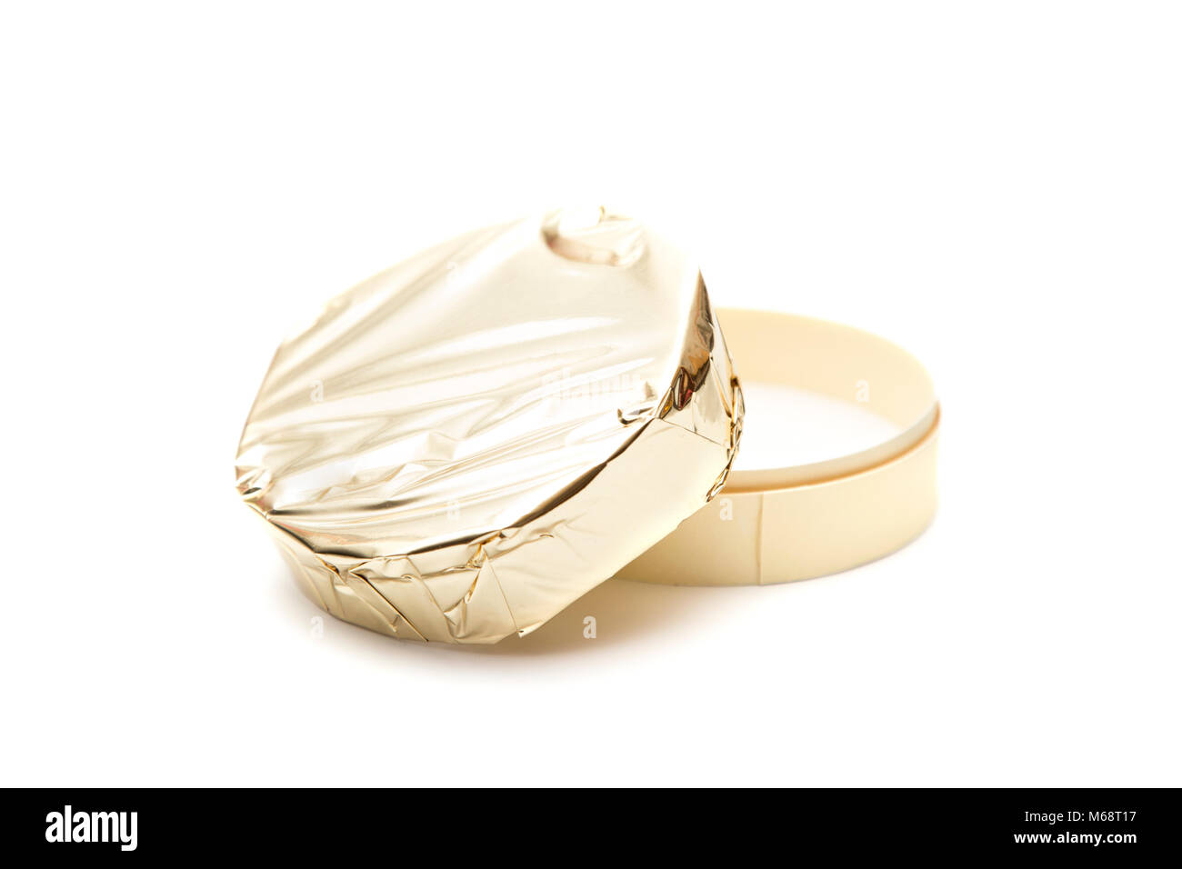 Beautiful Round of Soft Cheese with Gold Foil Wrapper Stock Photo - Alamy