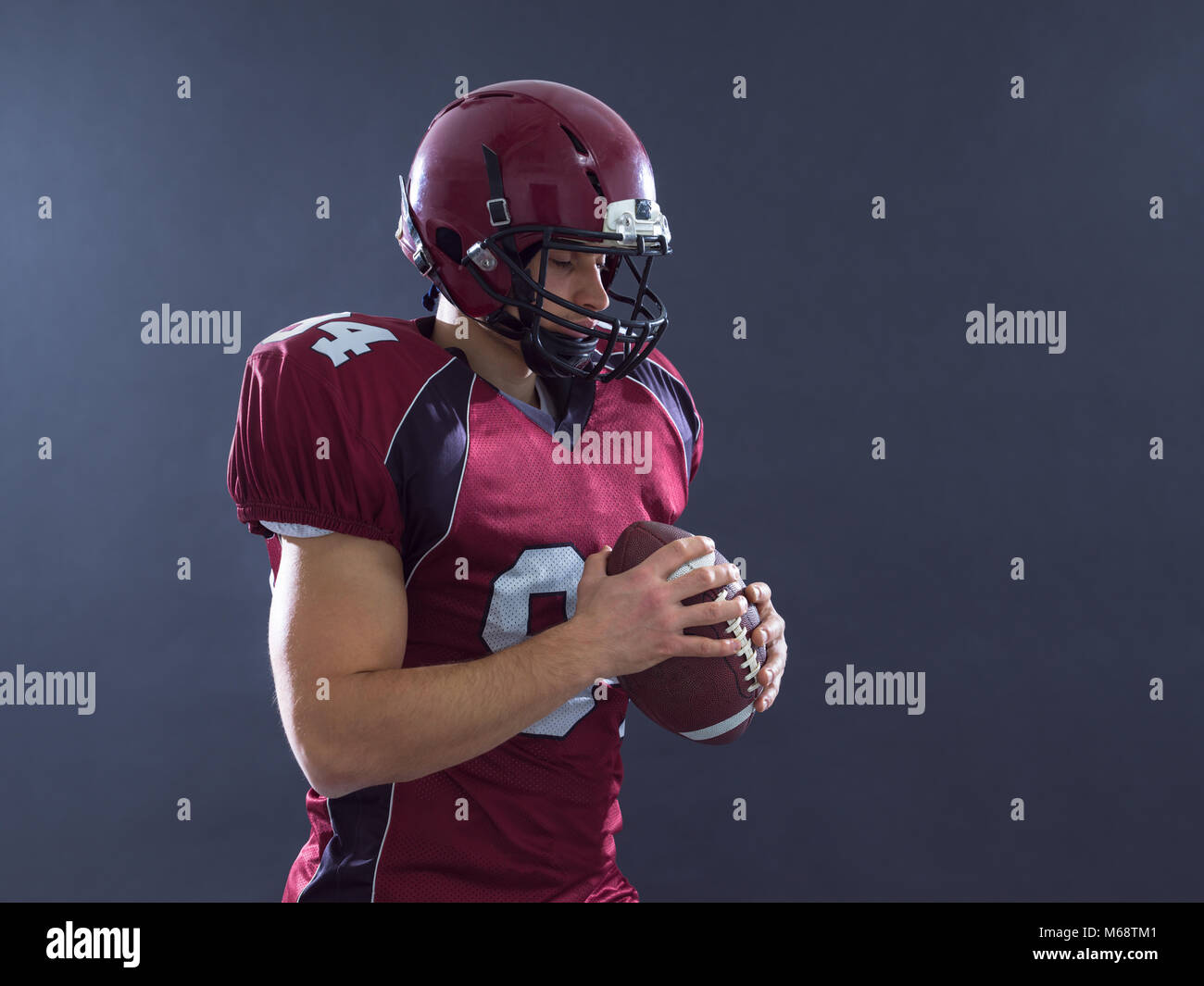 one quarterback american football player throwing ball isolated on gray ...