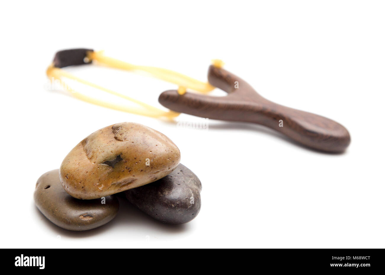 Slingshot Representing the Fight Between David and Goliath on a White ...