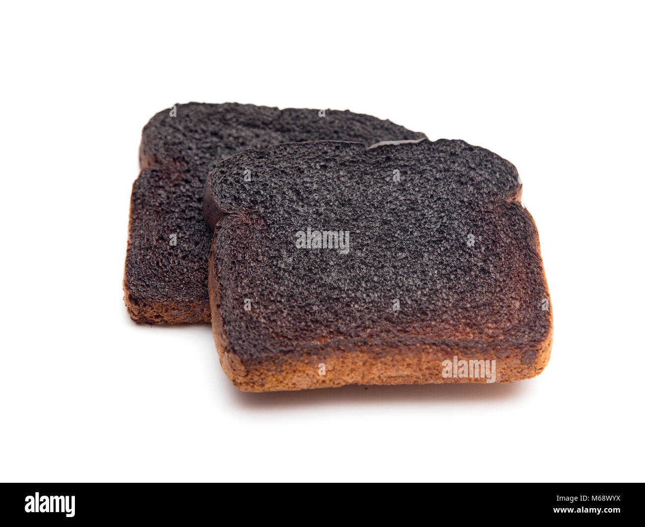 Burned Toast on a White Background Stock Photo - Alamy