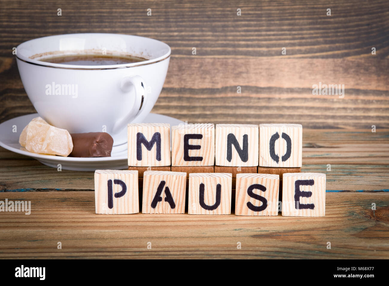 menopause. Wooden letters on the office desk, informative and ...