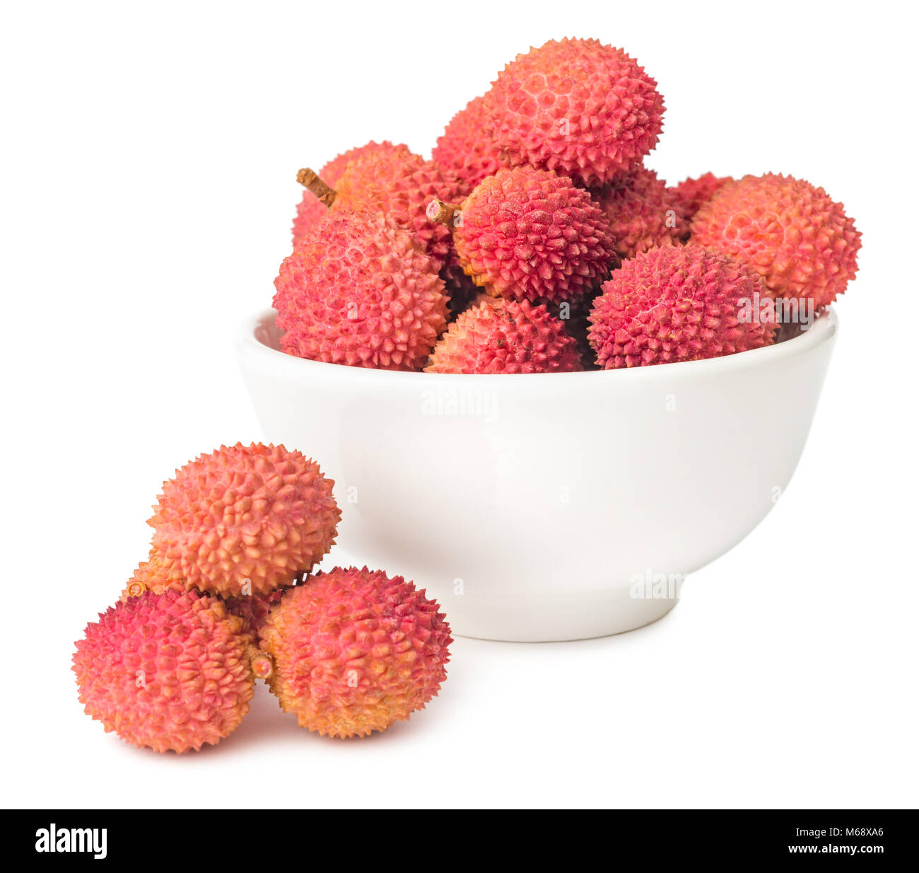 Sweet lychees fruits in bowl isolated on white background Stock Photo ...