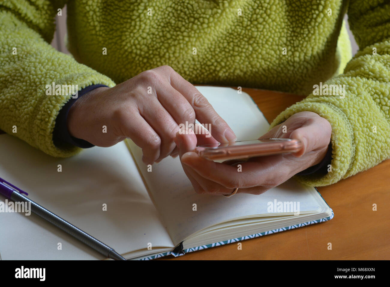 Woman using a digital device with a touch screen Stock Photo - Alamy