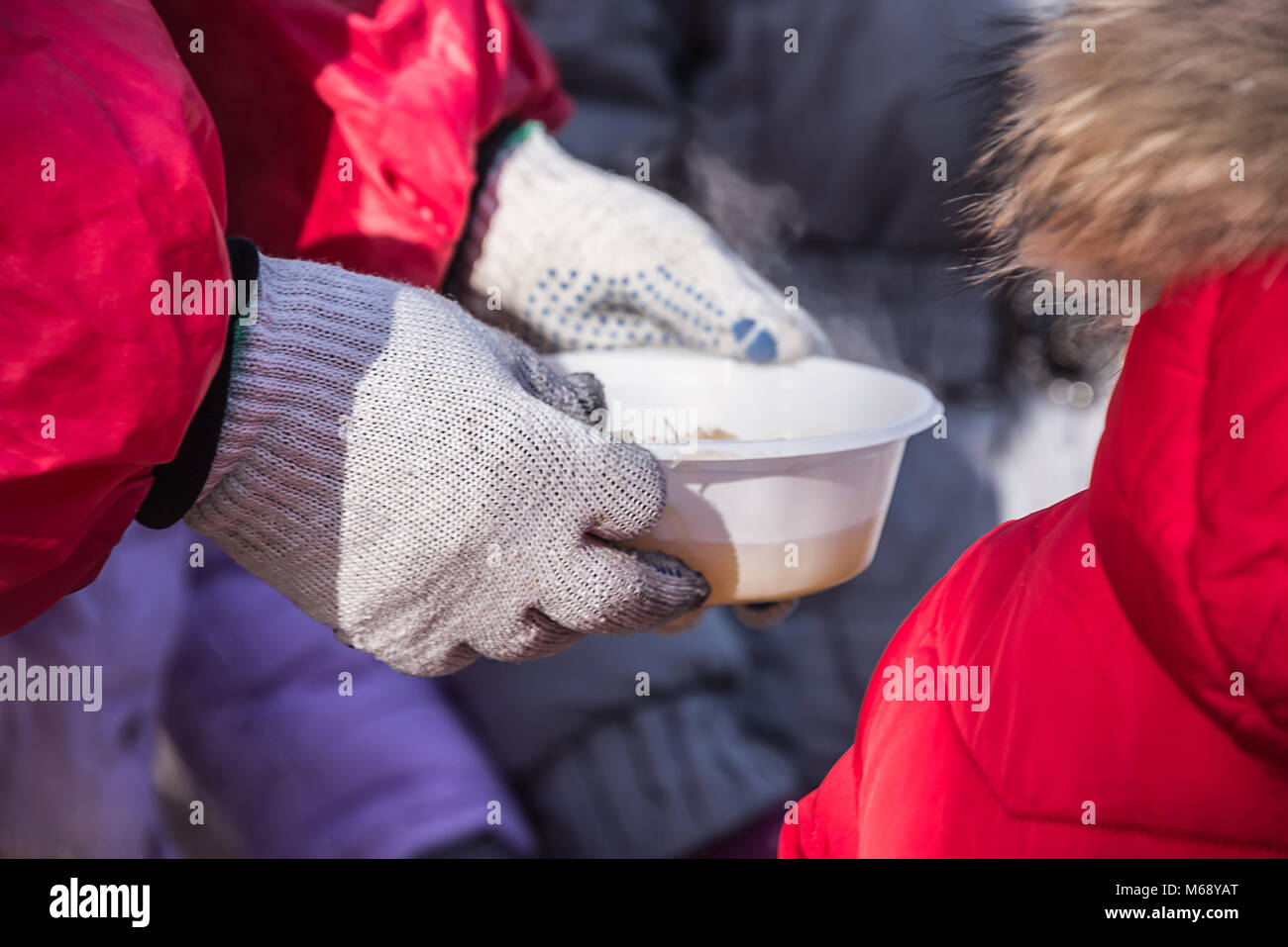 feeding homeless people on the street, social problems, hungry people ...