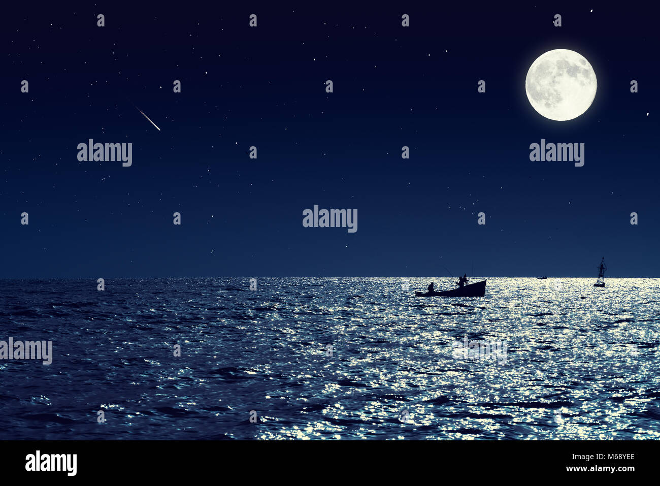 Scenic view of small fishing boat in calm sea water at night and full ...