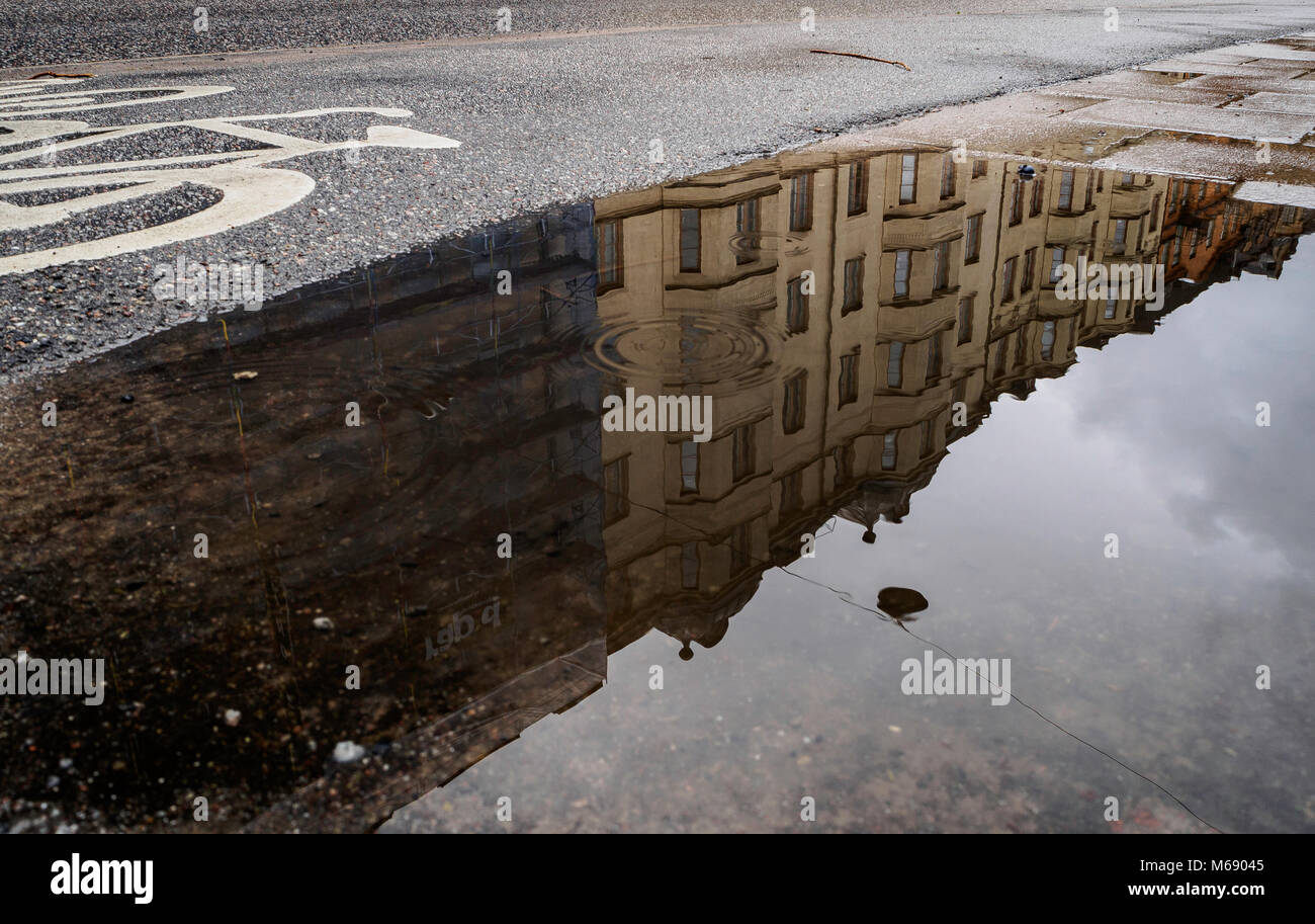 reflections of houses in a water pool in the street Stock Photo - Alamy