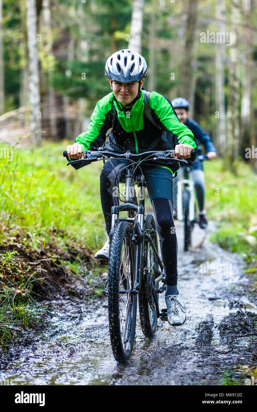 Two teenage girls riding bikes hi-res stock photography and images - Alamy