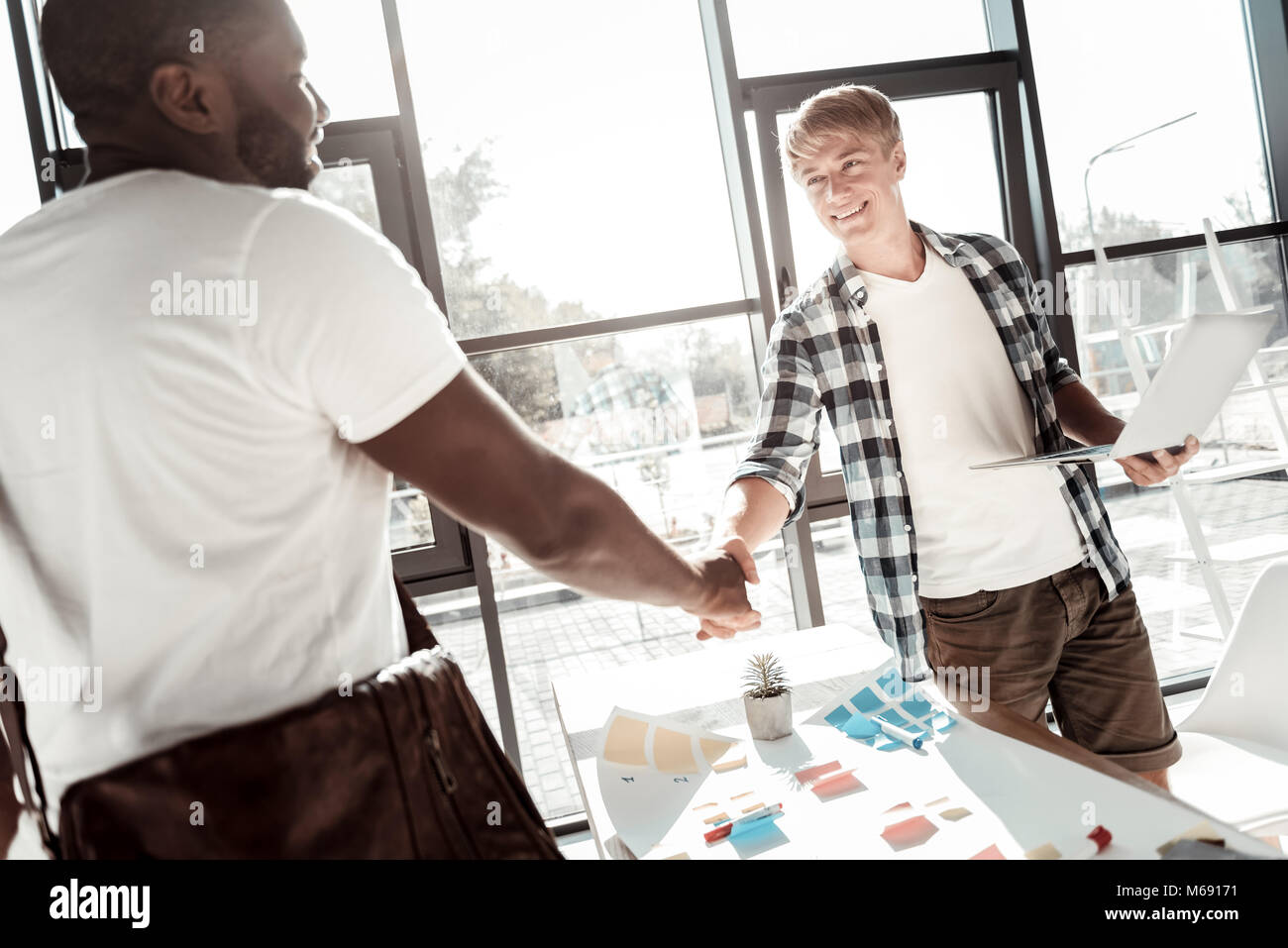 Nice smart young colleagues hi-res stock photography and images - Alamy