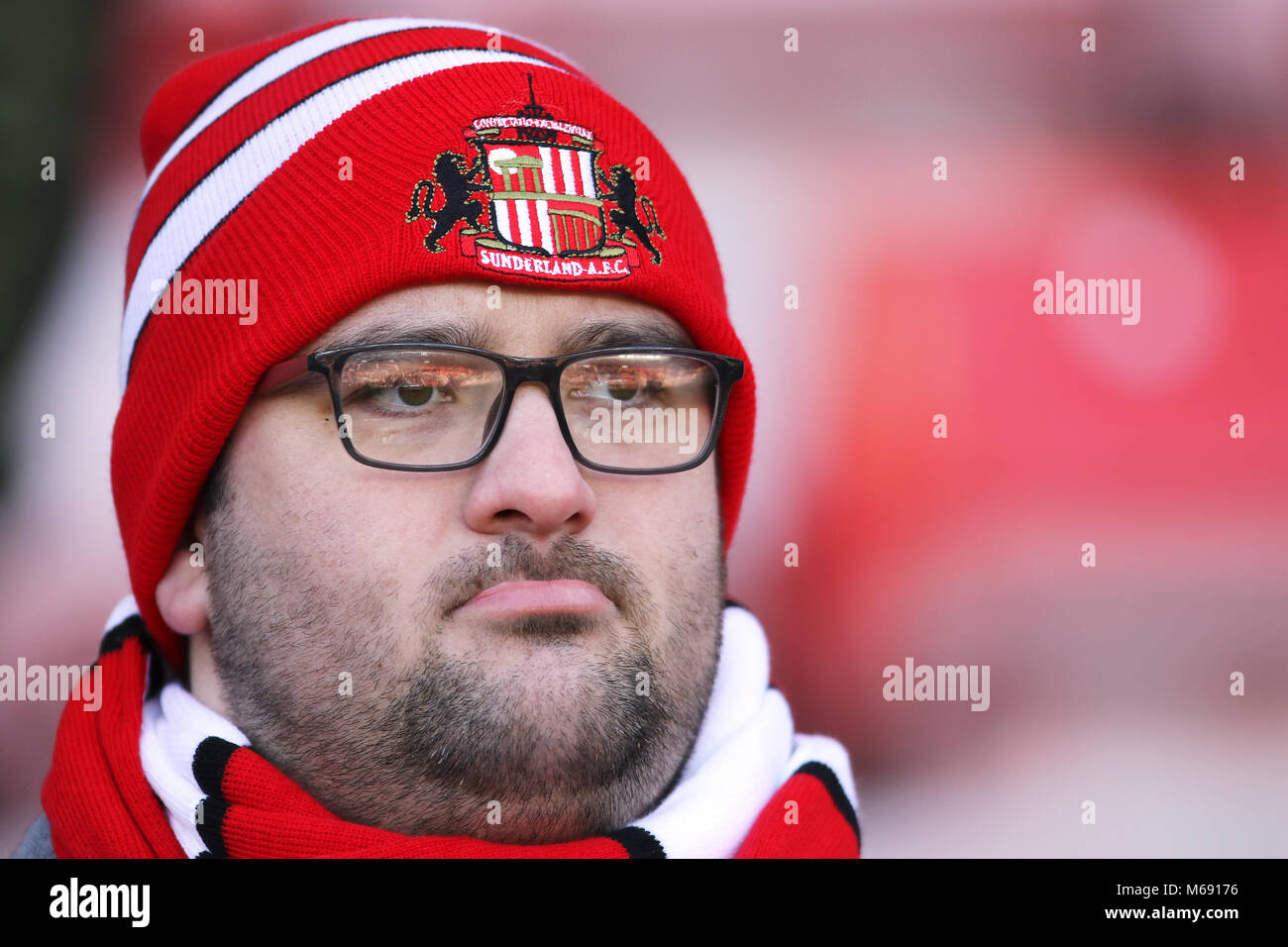 A Sunderland fan looks on from the stands Stock Photo - Alamy