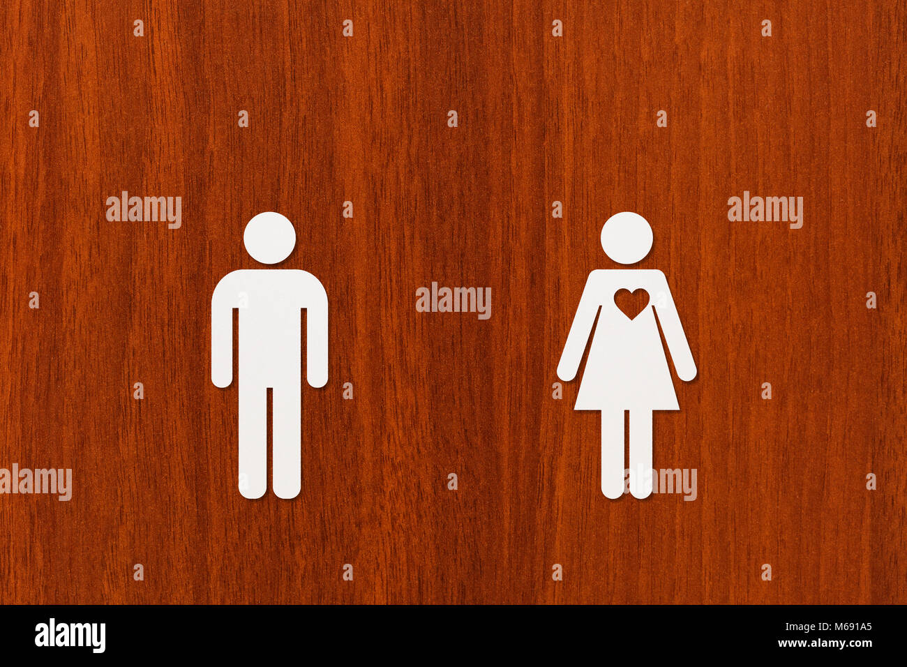 Paper man and woman with heart. Love, relation concept on wooden ...