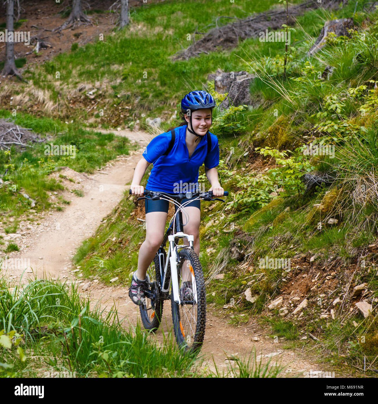 Healthy lifestyle - teenage girl cycling Stock Photo - Alamy