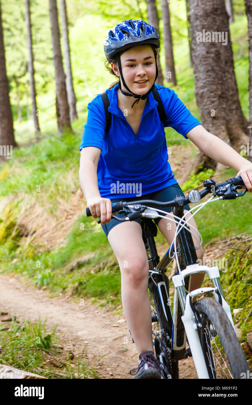 Healthy lifestyle - teenage girl cycling Stock Photo - Alamy