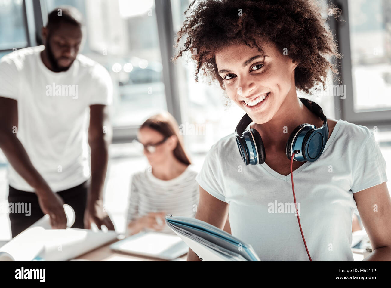 Cheerful happy woman looking at you Stock Photo - Alamy