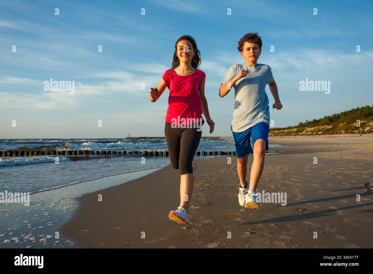 Two Teenagers Running Boy Girl High Resolution Stock Photography and ...