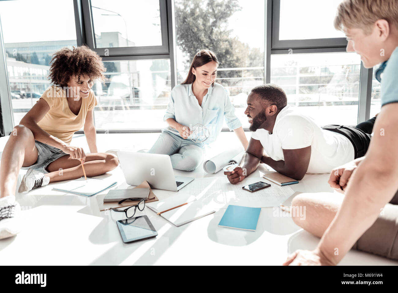 Happy positive people discussing their ideas Stock Photo - Alamy