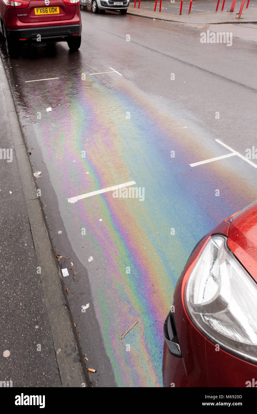 Light rainfall making the unseen petrol diesel oil spilling from cars ...