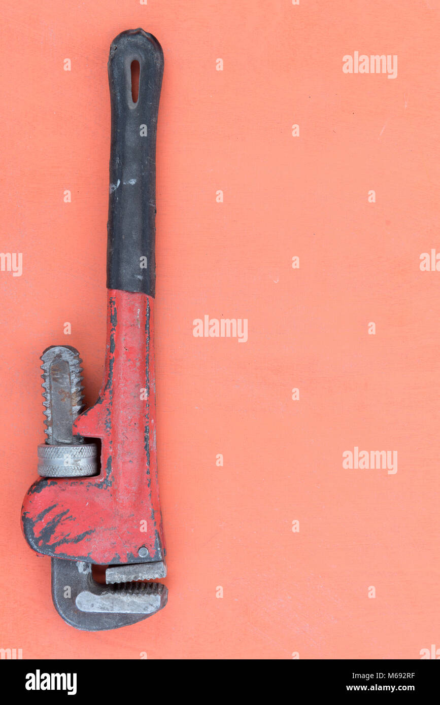 tools on a orange background Stock Photo - Alamy
