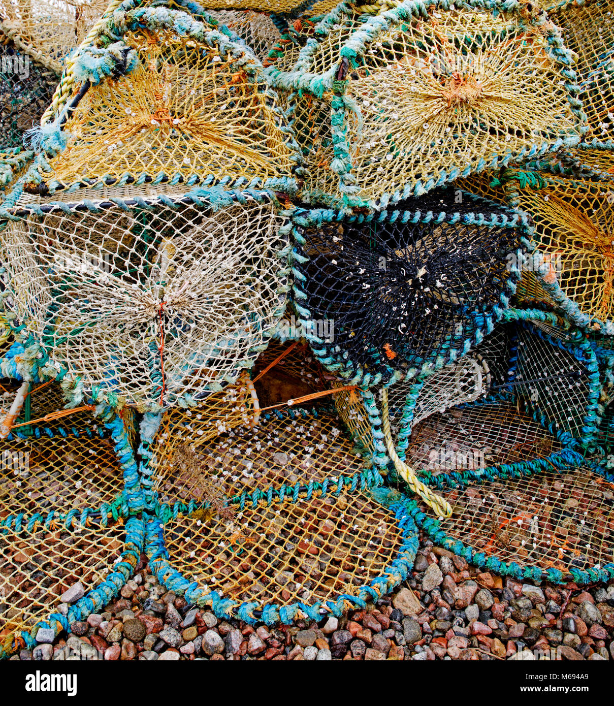 Close-up of colourful stacked lobster creels at Kylesku on Loch Glendhu ...