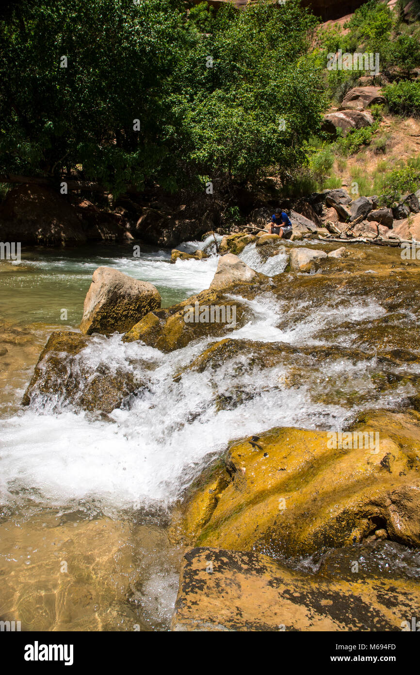 Water and rocks are splashing along the river Stock Photo - Alamy