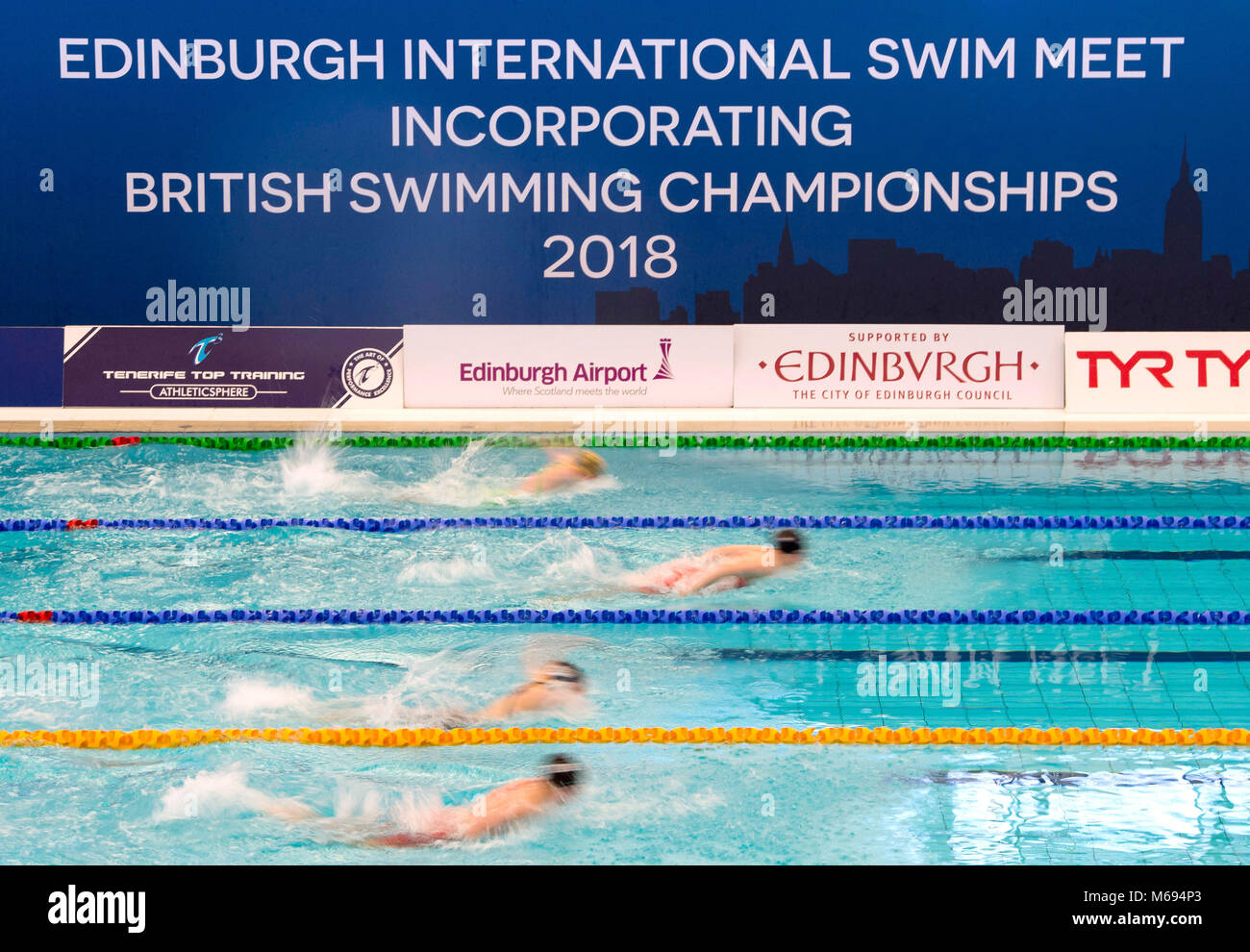 Swimmers compete in the Women's 100m Butterfly event during day one of ...