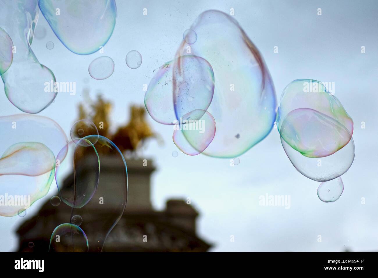 bubbles in font of statue in a Barcelona park Stock Photo - Alamy