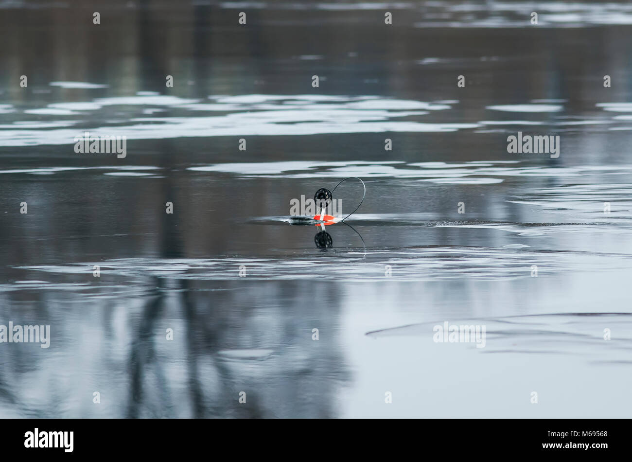 the imitation fish tackle for fishing live bait mounted on a hole on a ...