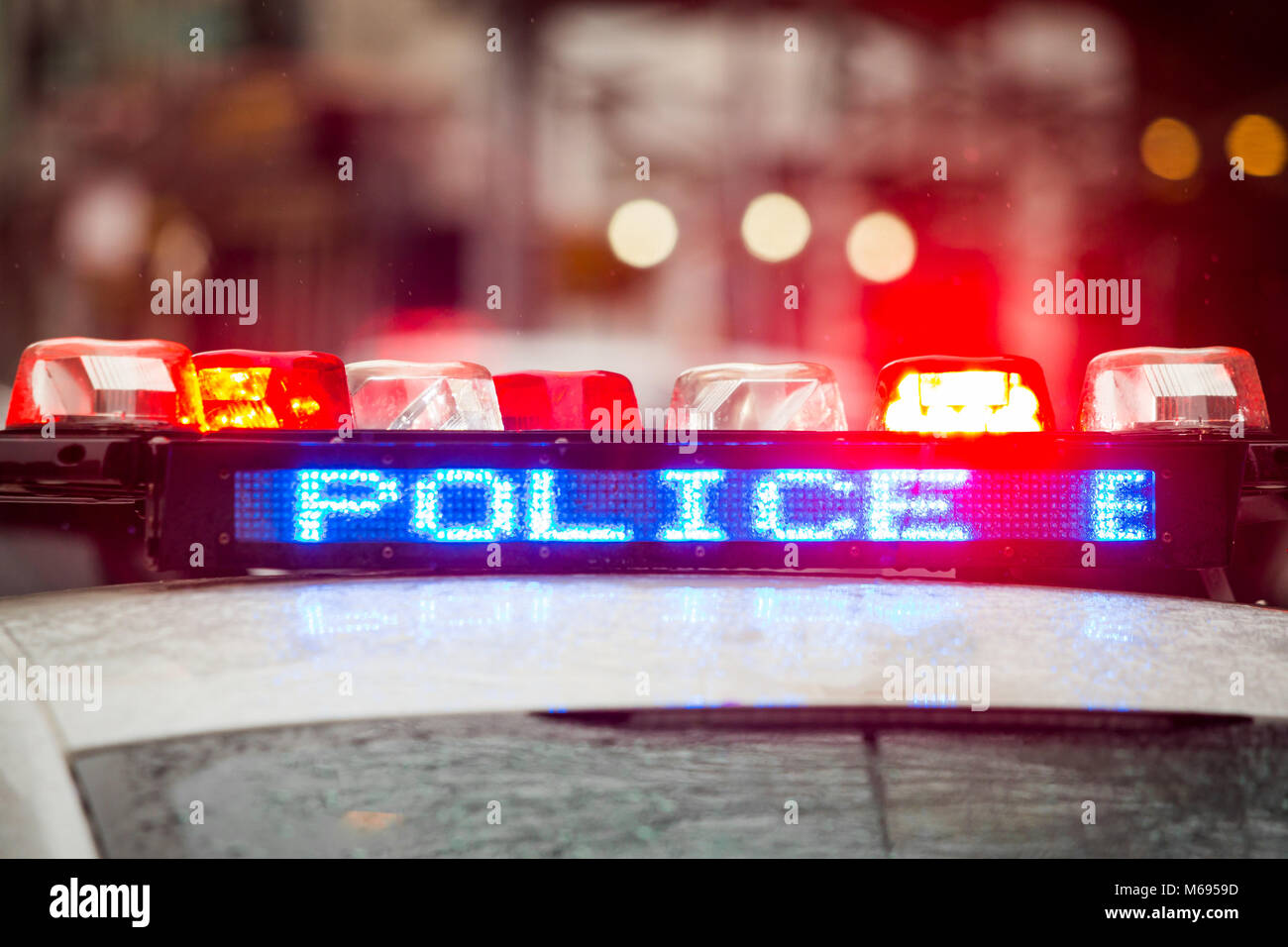 Police emergency lights with warning text close up display Stock Photo ...