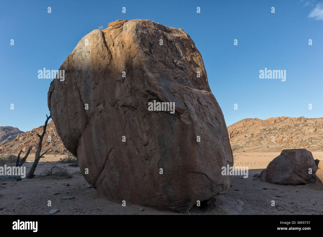 Giant stone in the desert Namibia Stock Photo - Alamy