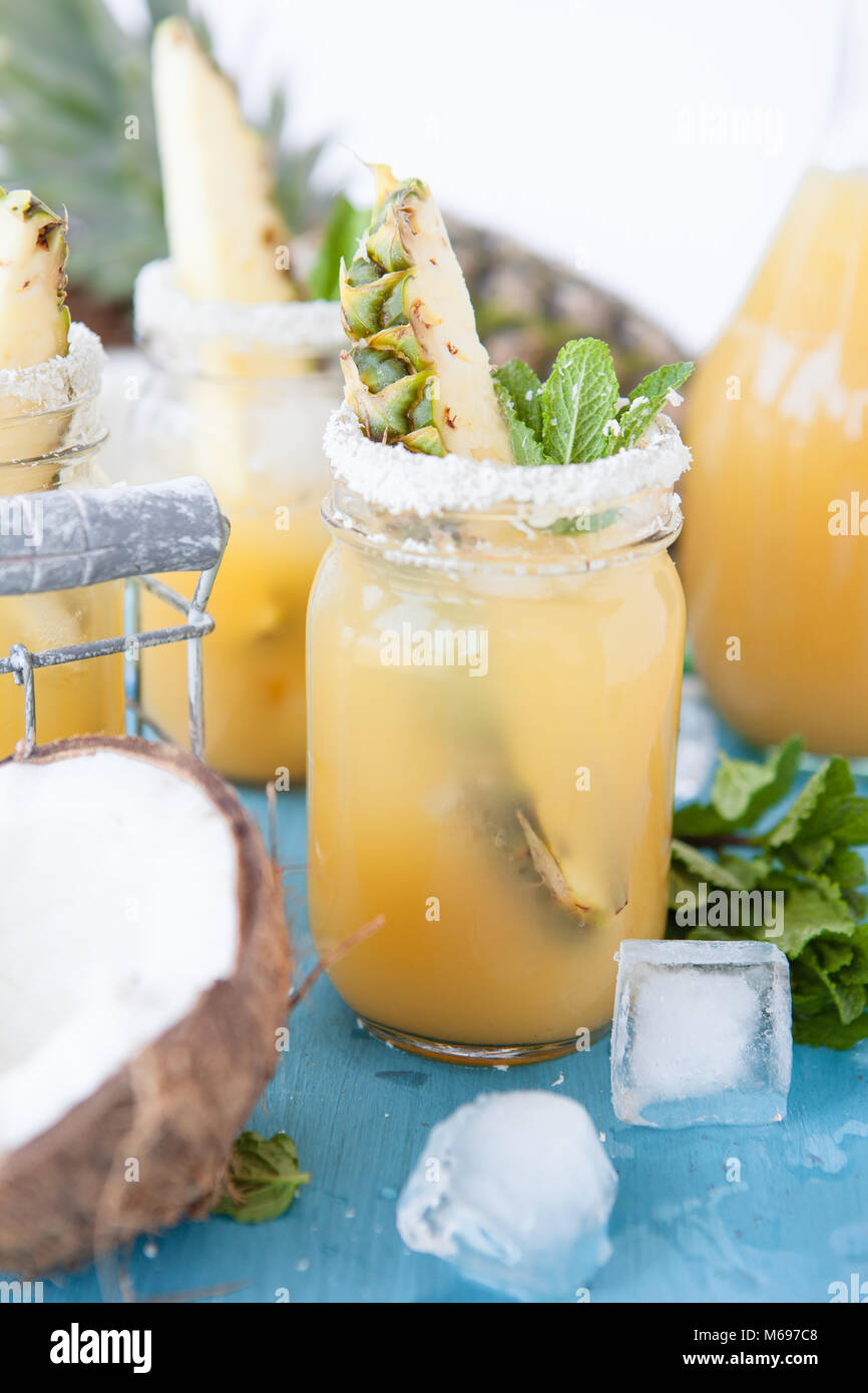 Ice cold fruity cocktail with pineapple and coconut Stock Photo - Alamy